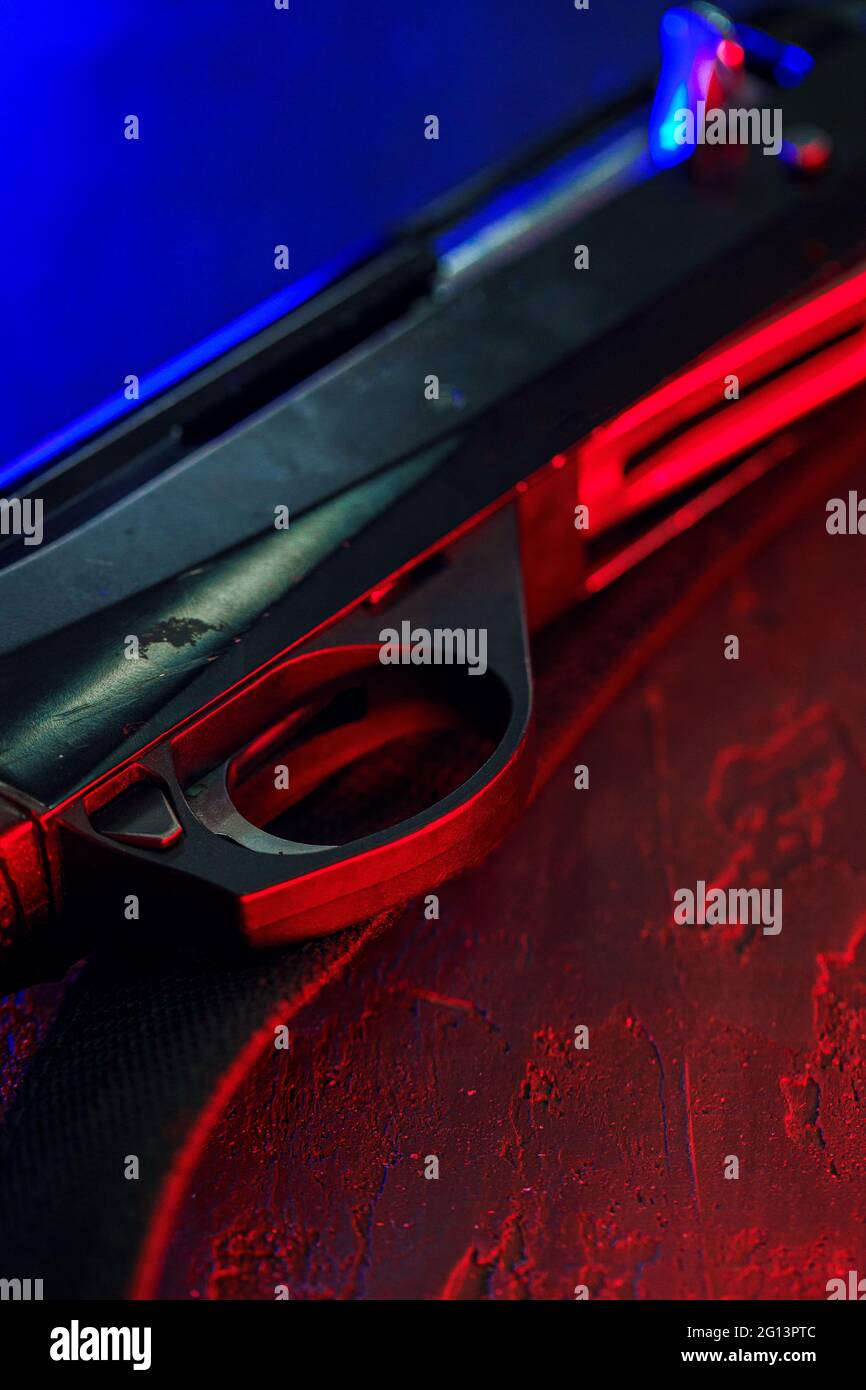 Hunting shotgun on black background with red and blue backlight Stock ...