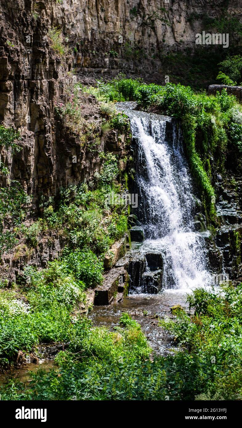 Summer background with waterfall stream among rocks Stock Photo - Alamy