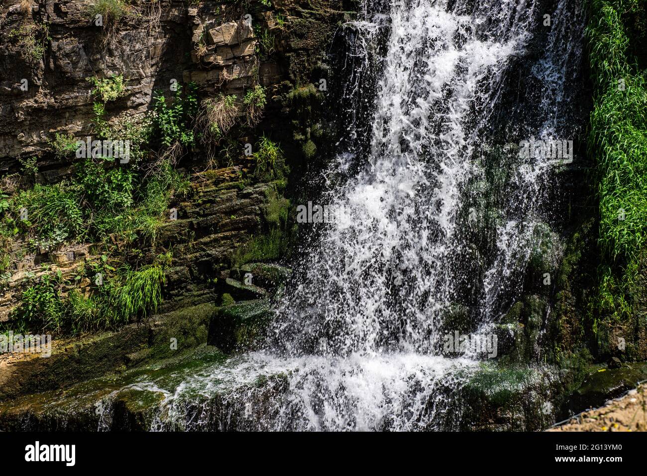 Summer background with waterfall stream among rocks Stock Photo - Alamy