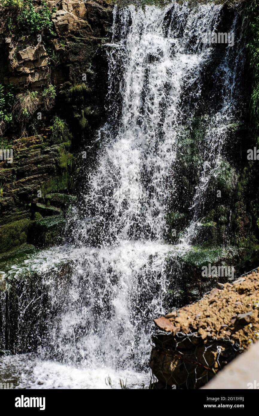 Summer background with waterfall stream among rocks Stock Photo - Alamy