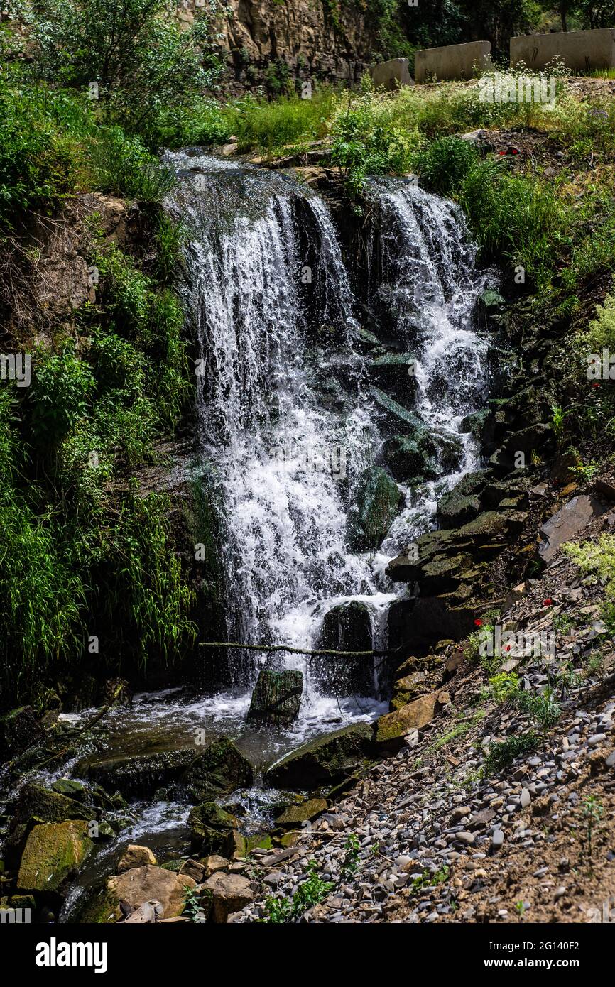 Summer background with waterfall stream among rocks Stock Photo - Alamy