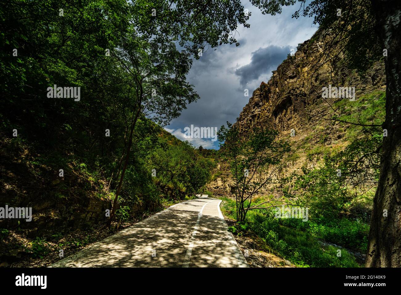 Summer landscape with road in canyon with rock wall and road Stock ...