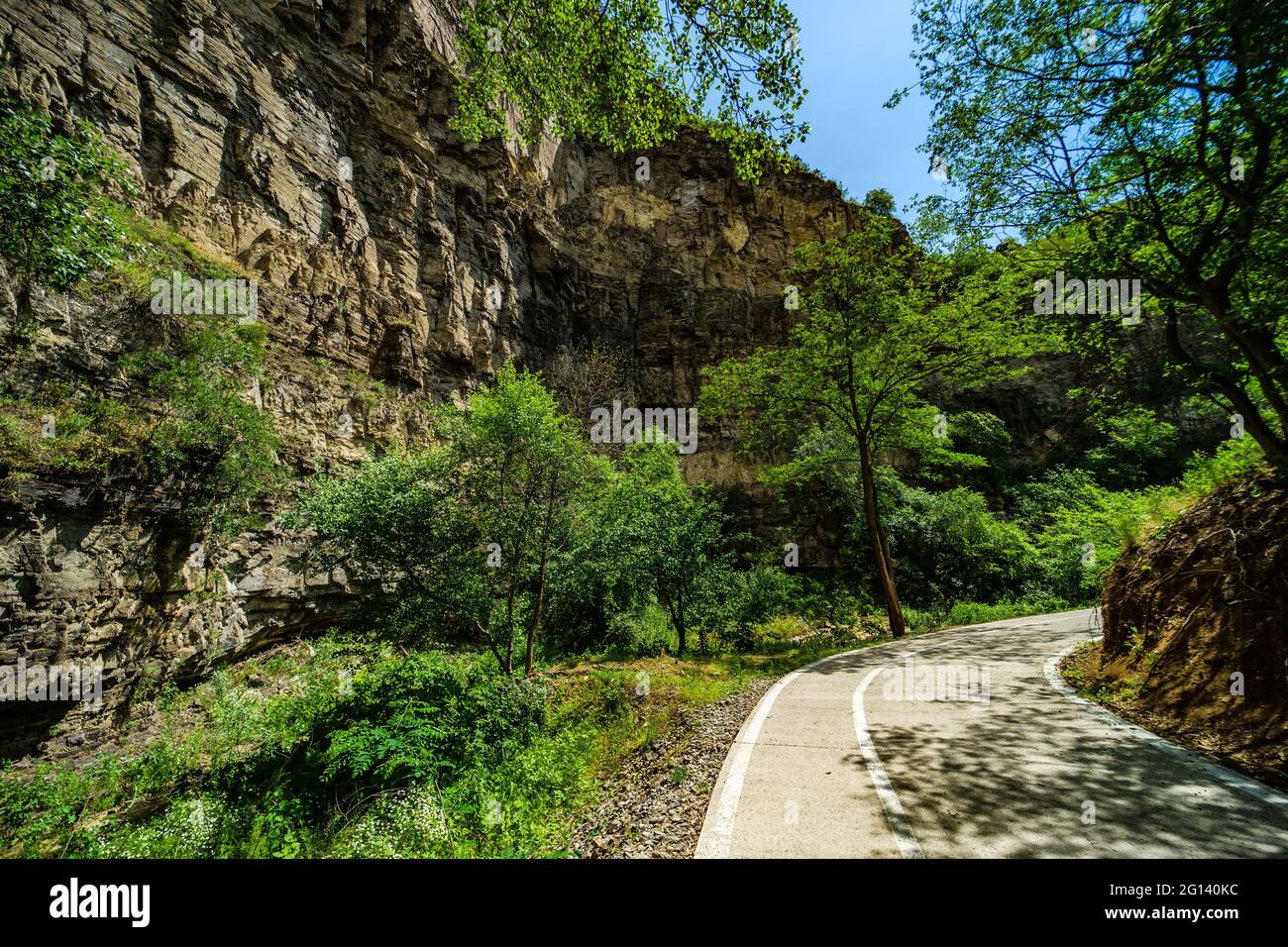 Summer landscape with road in canyon with rock wall and road Stock ...