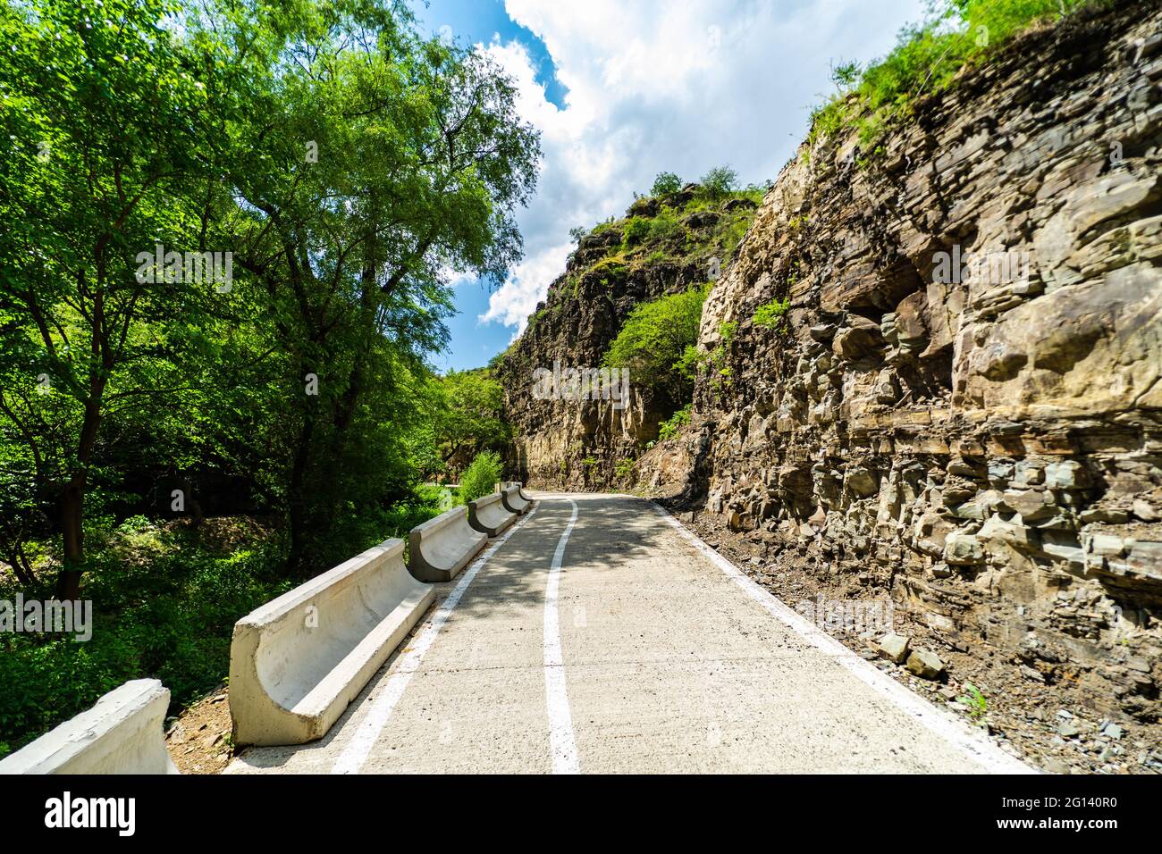 Summer landscape with road in canyon with rock wall and road Stock ...