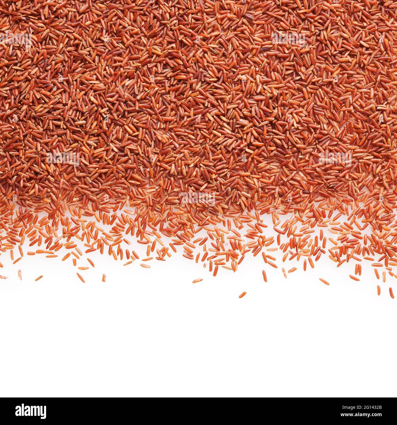 Uncooked red rice on white background with copy space Stock Photo - Alamy