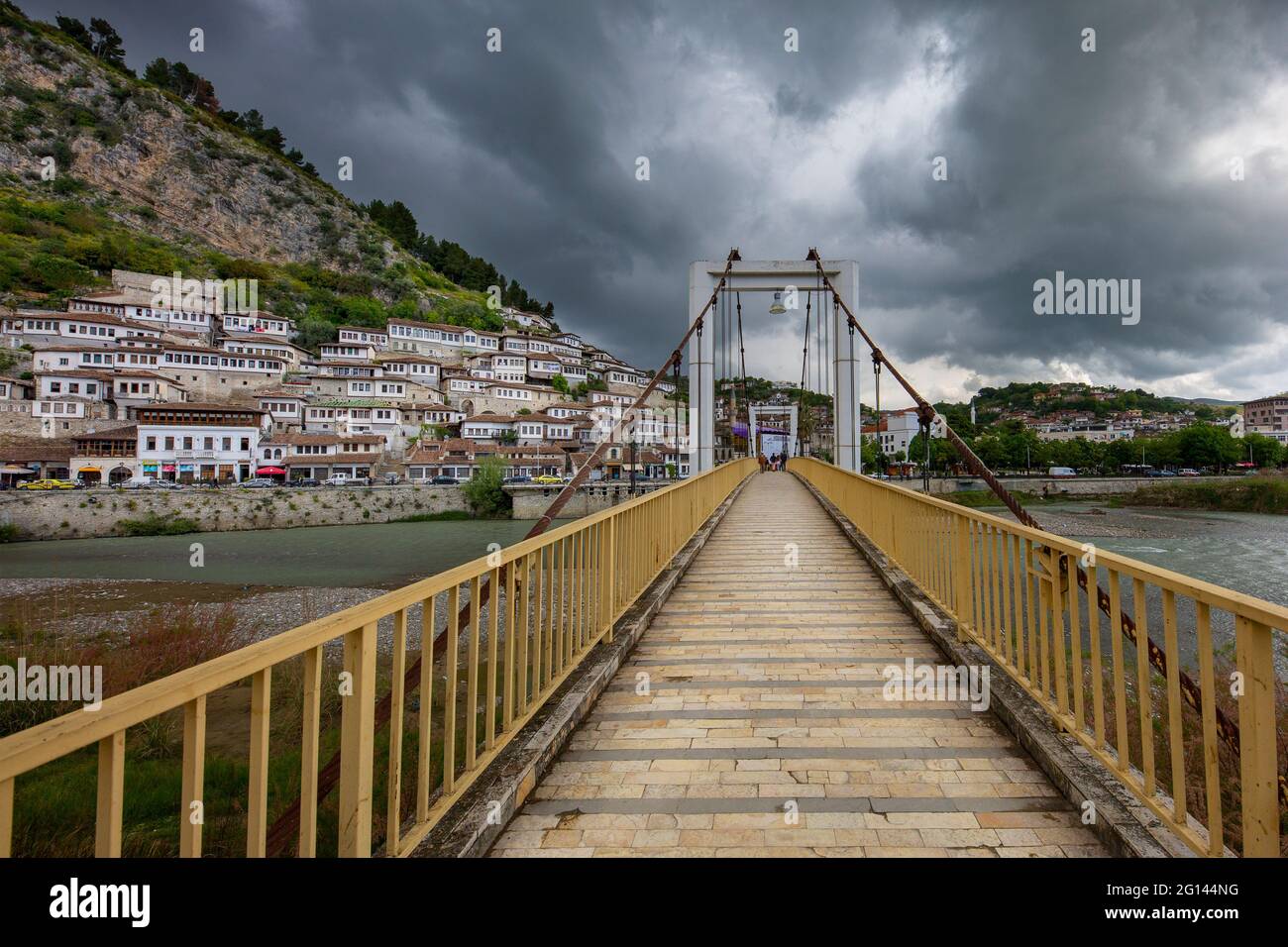 Pedestrian bridge with traditional houses in the background, in Berat ...