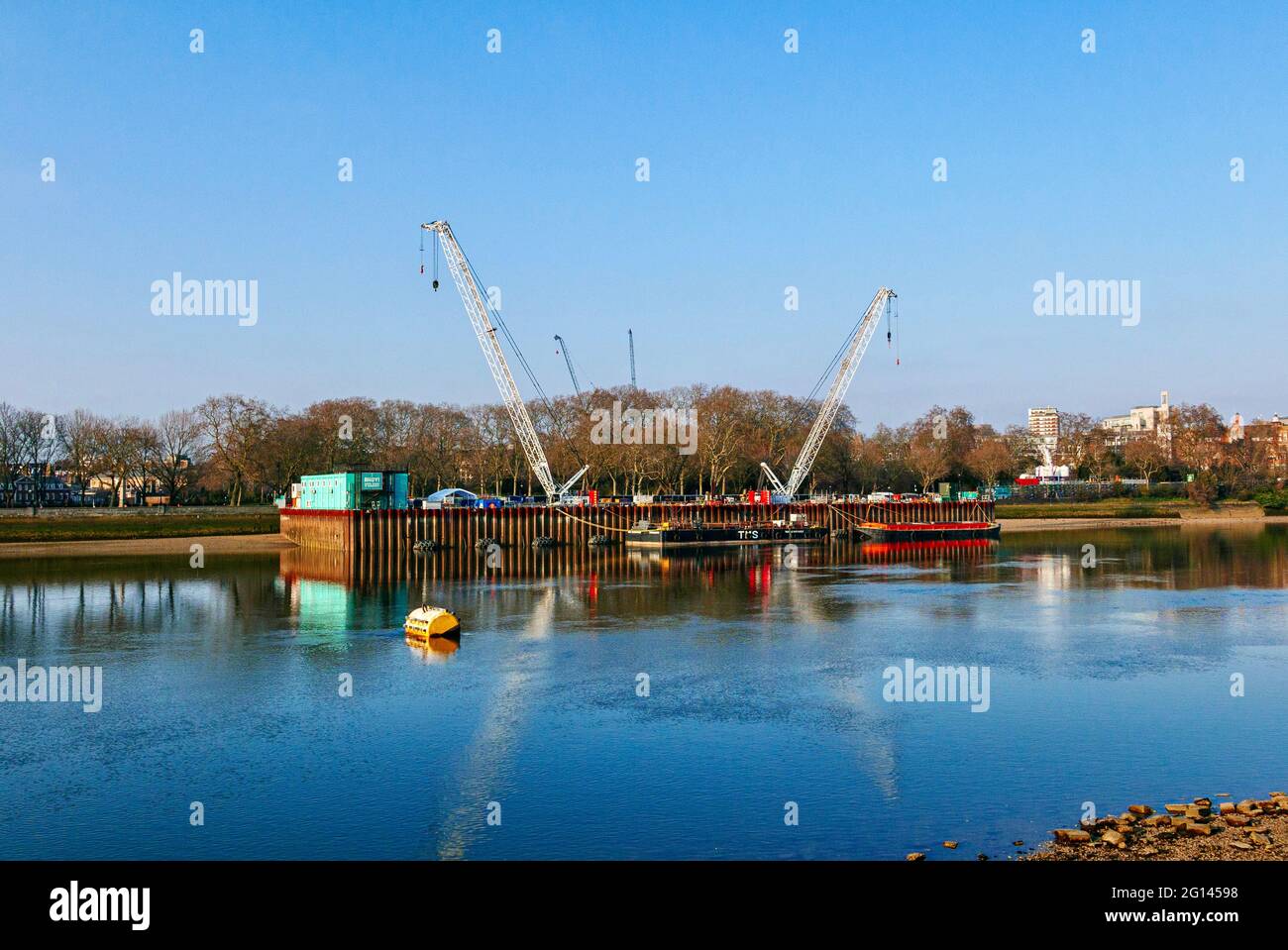 River Thames view from Battersea Park, London, with blue skies and ...