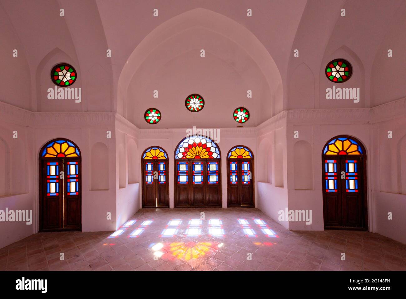 Room with stained glass windows in the traditional historic Iranian ...