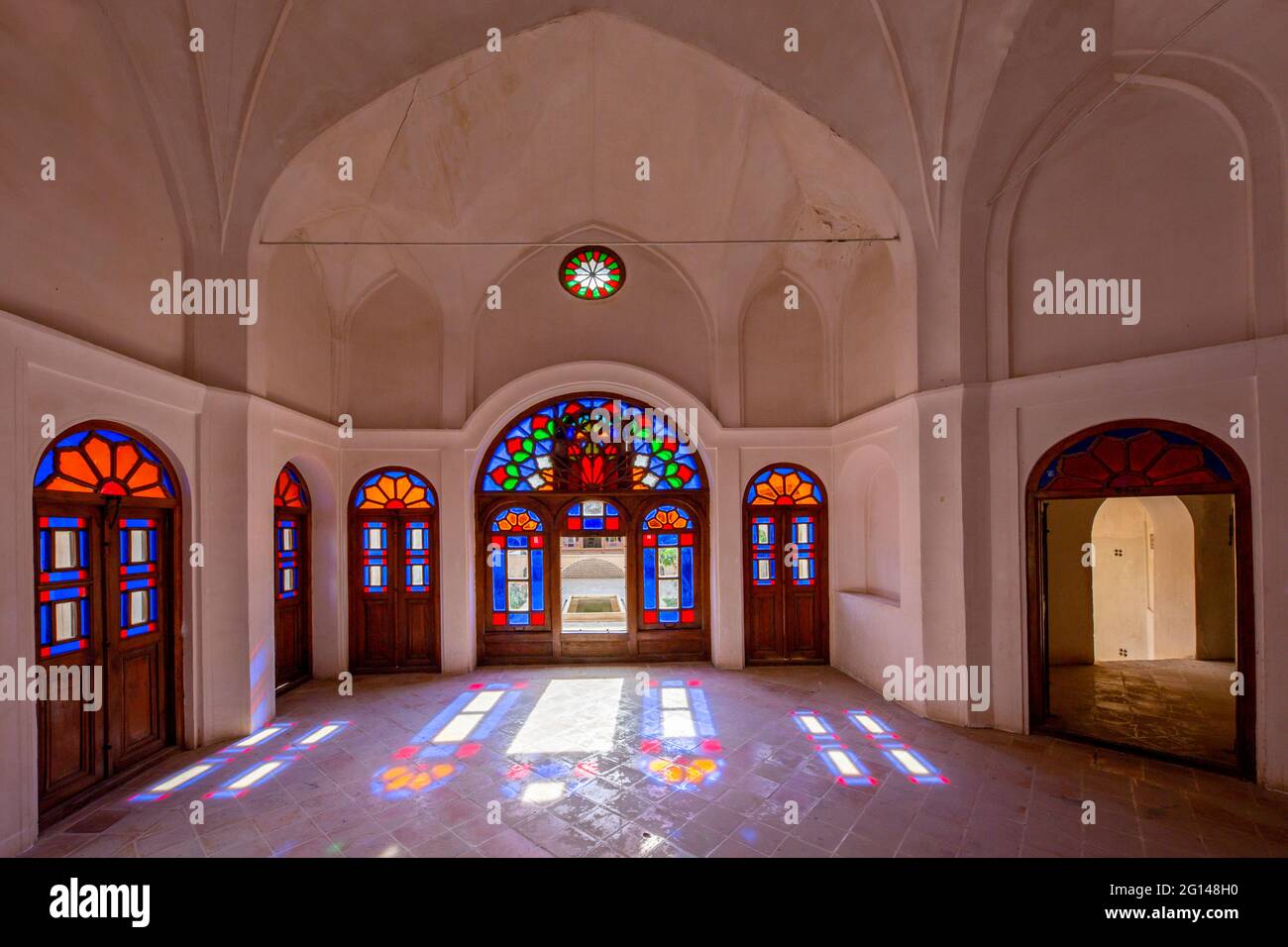 Room with stained glass windows in the traditional historic Iranian ...