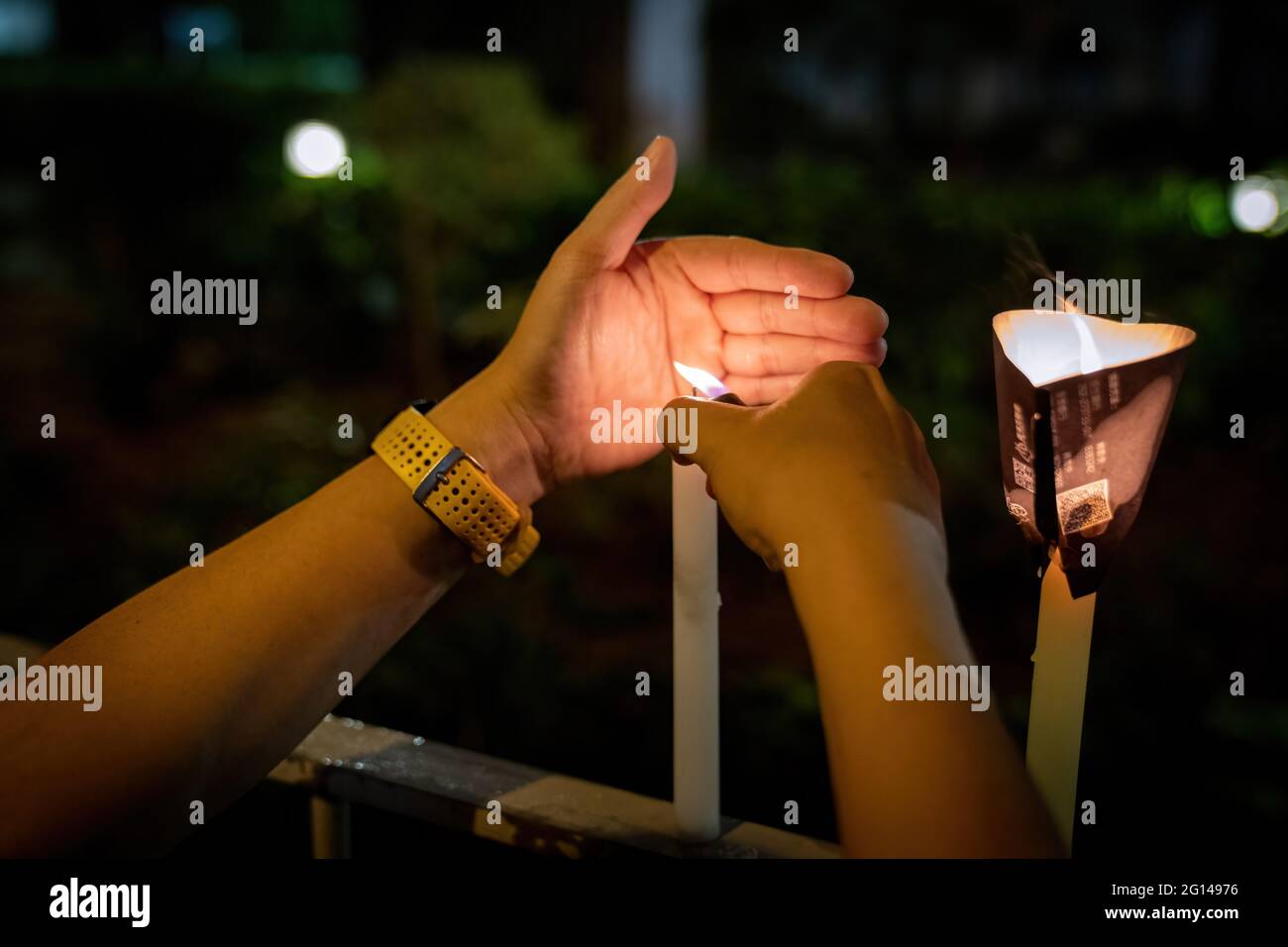A candle lit as part of the small protests by Hong Kong people during ...