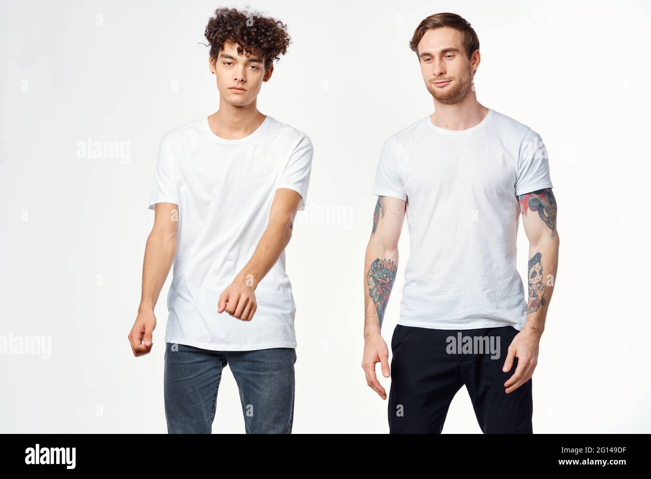 two funny friends in white t-shirts laughing positive emotions Stock ...