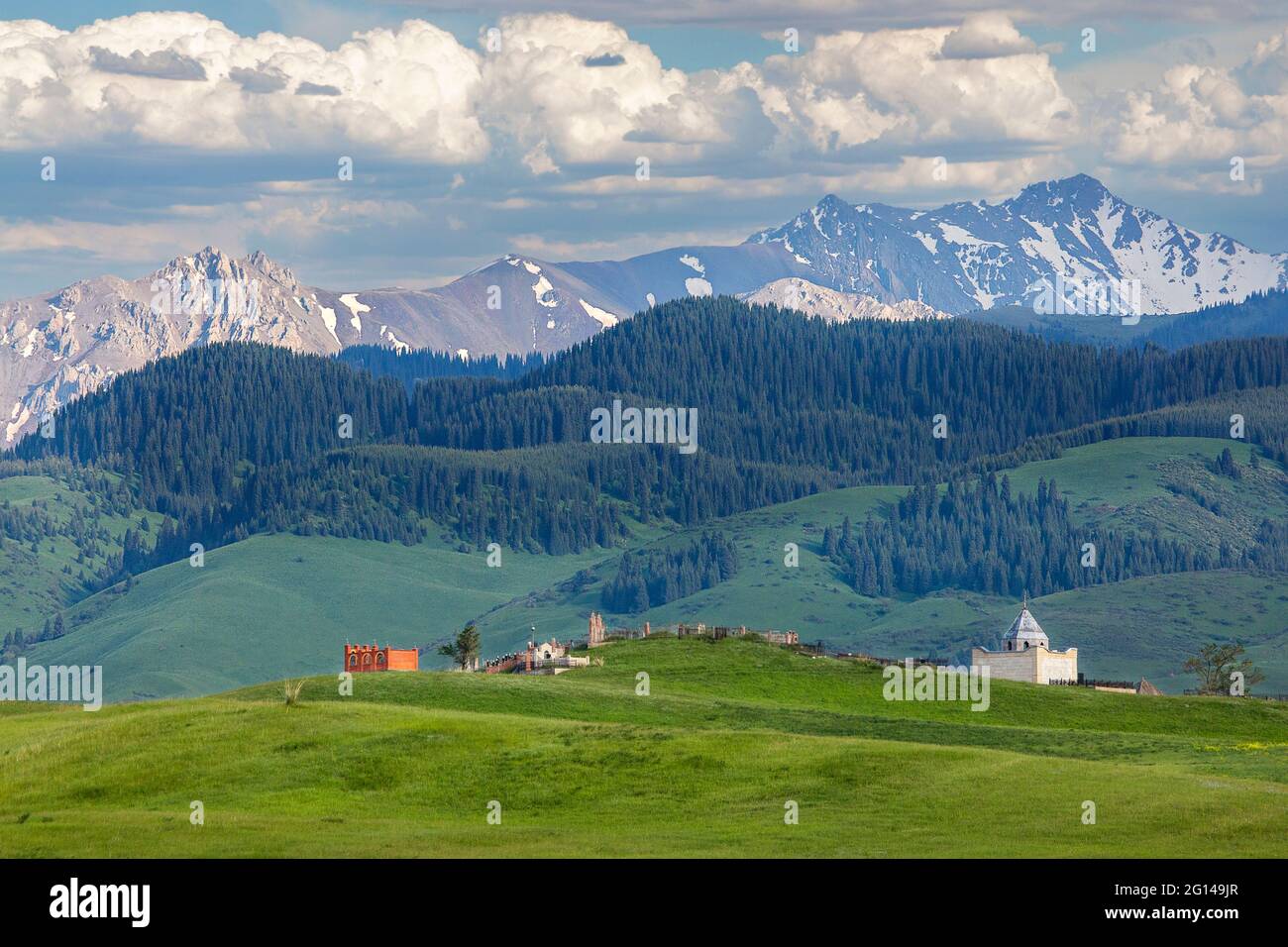 Central Asian muslim cemetery with mountain backdrops in Kazakhstan ...