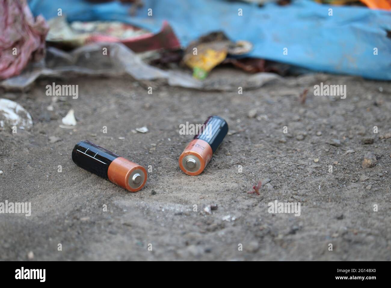 Used batteries are lying on the garbage dump Stock Photo - Alamy