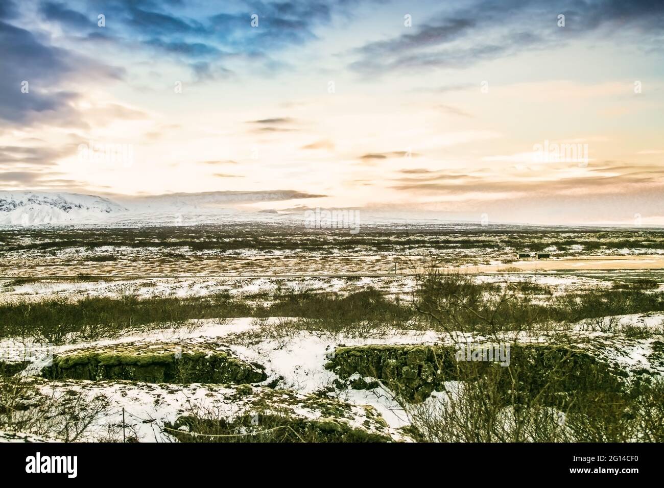 Beautiful winter Icelandic landscape with mountains covered in snow and ...