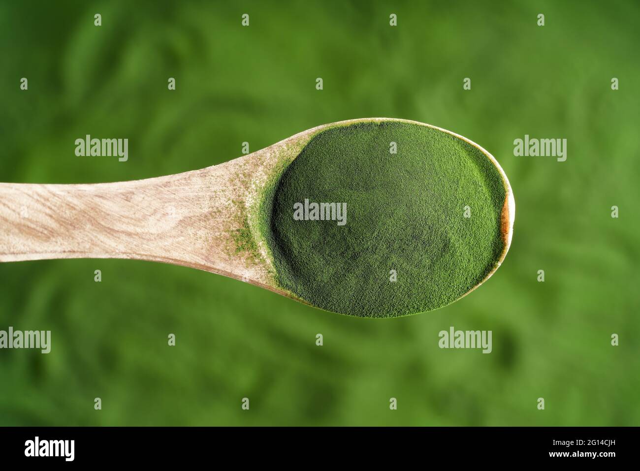 Green chlorella algae powder on a spoon, top view Stock Photo - Alamy