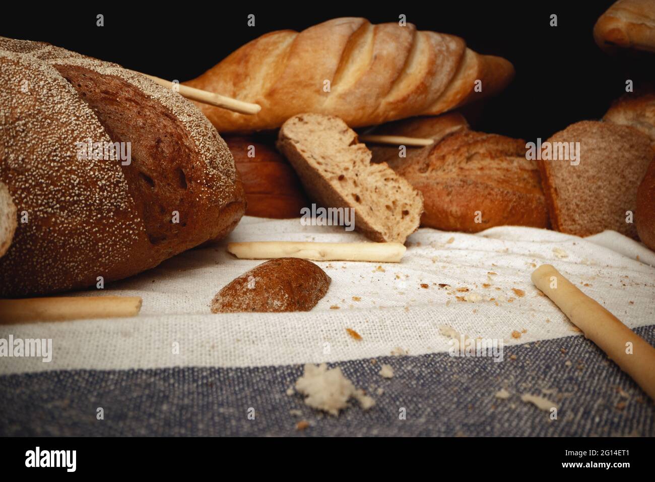 Variety of bread on tablecloth close up Stock Photo - Alamy