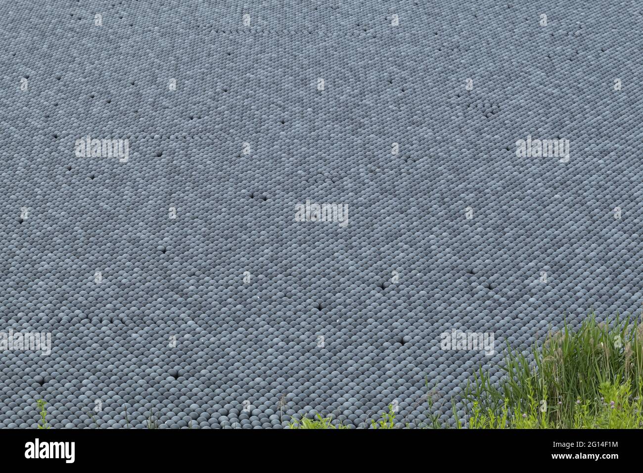 Black balls to protect reservoirs from the sun. Shade balls, small ... Black balls to protect reservoirs from the sun. Shade balls, small ...