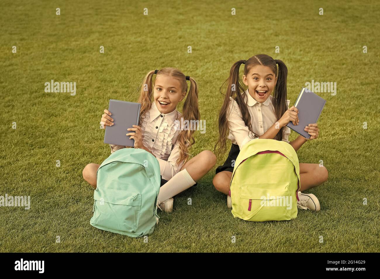 Books are best friends. Happy kids hold books outdoors. Adorable ...