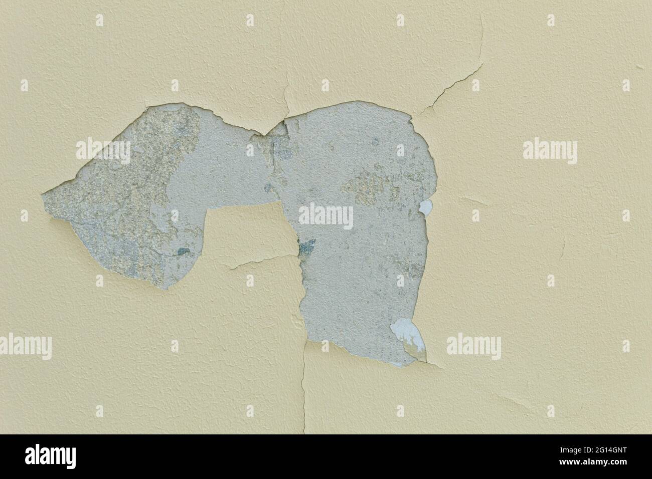 Peeling paint and plaster from the wall. Bloated paint and plaster ...