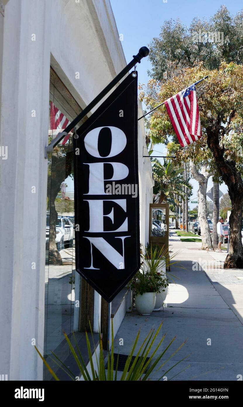 Vertical banner OPEN sign outside a local shop Stock Photo - Alamy