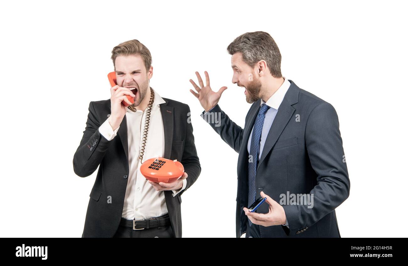 Man with smartphone look at angry businessman shouting in telephone ...