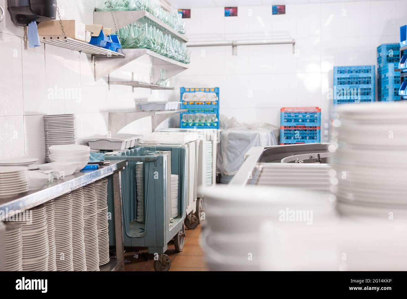 Restaurant kitchen with clean tableware Stock Photo - Alamy