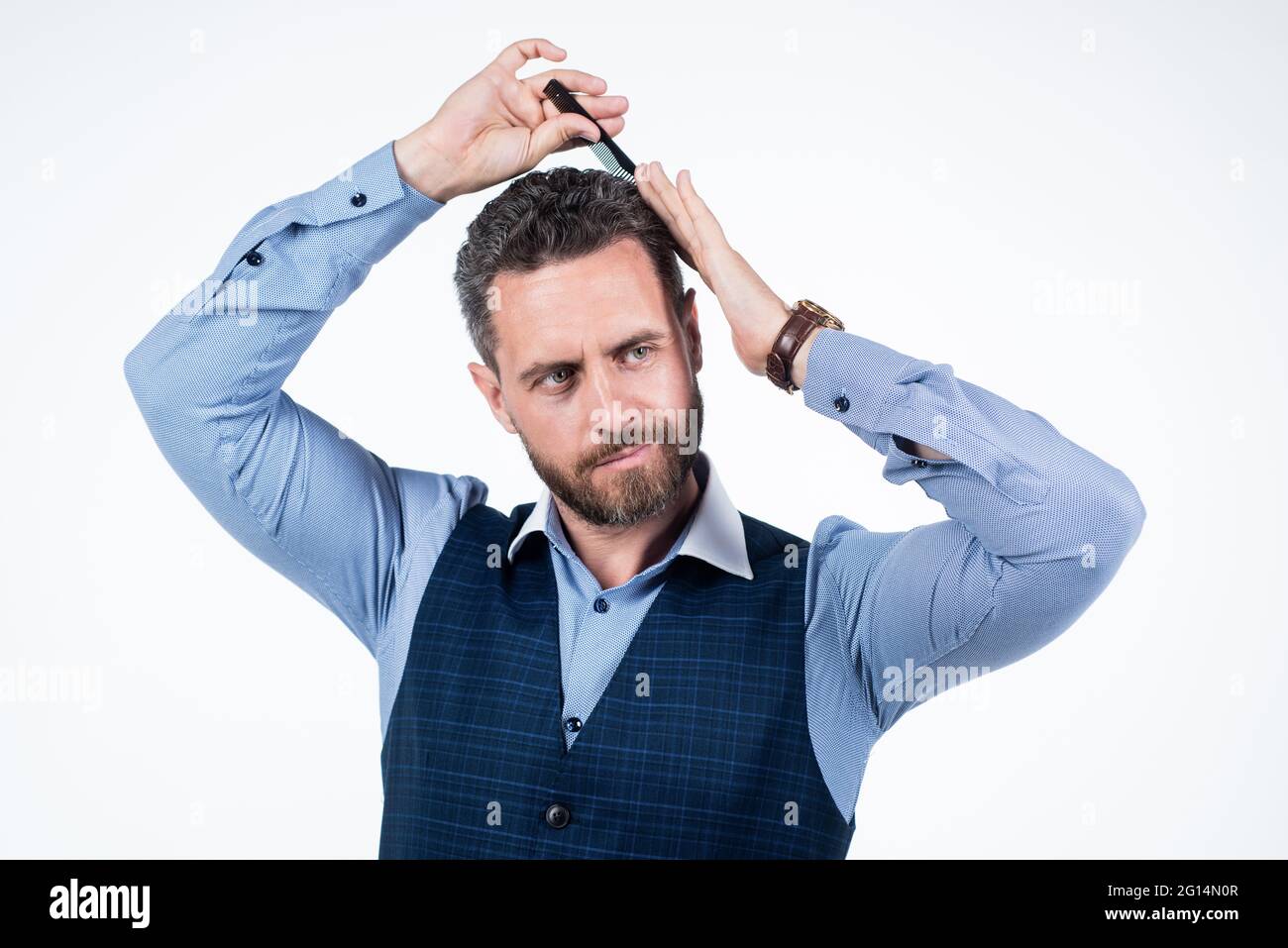 handsome man comb his hair with brush, barbershop Stock Photo - Alamy