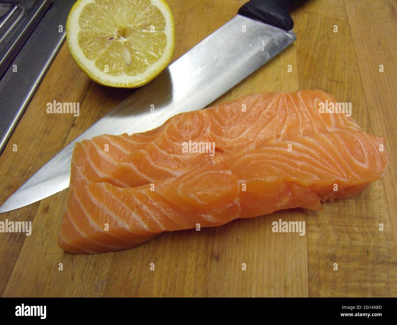 fresh fillet of wild salmon on the cutting block Stock Photo - Alamy