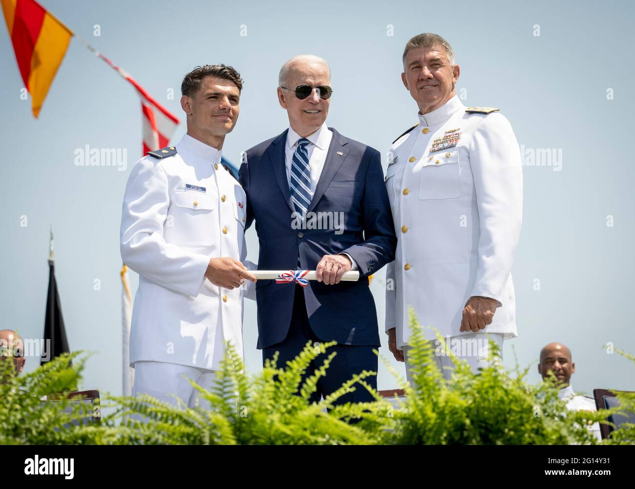 U.S President Joe Biden stands for a photo with a cadet and Coast Guard ...
