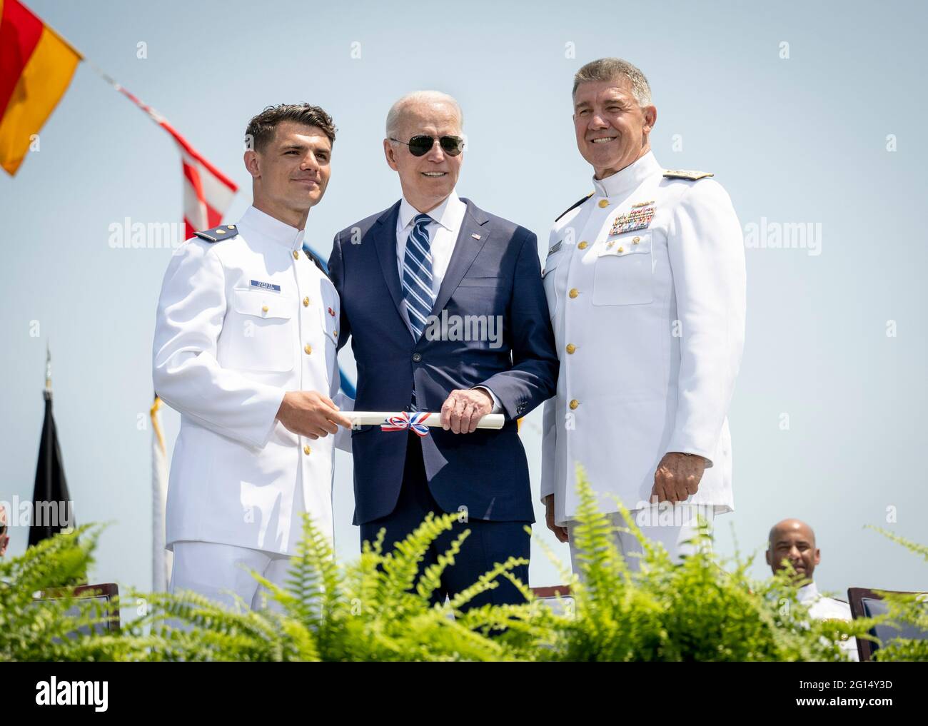 U.S President Joe Biden stands for a photo with a cadet and Coast Guard ...