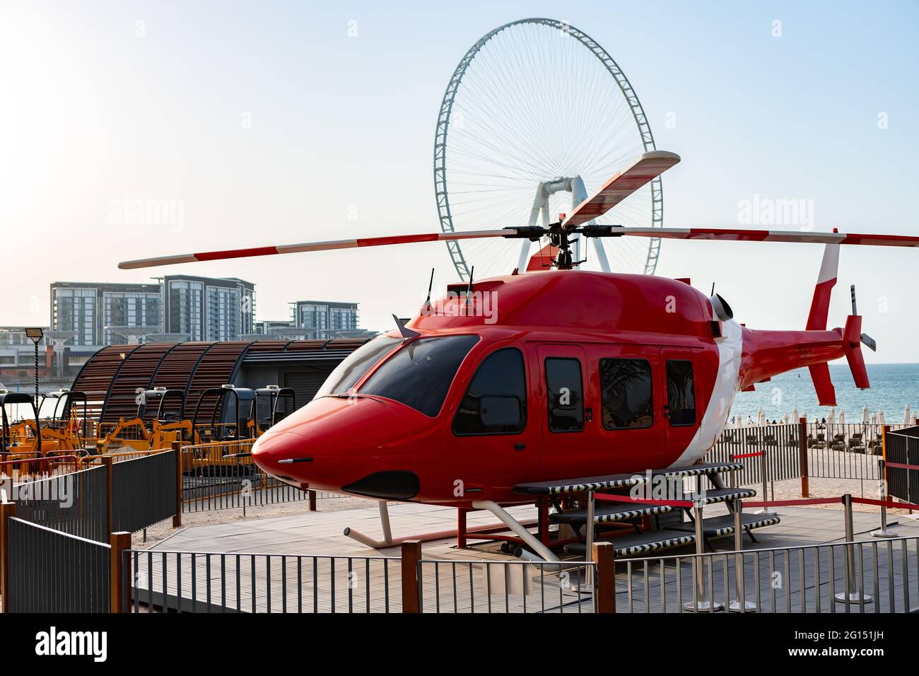 DUBAI, UAE - MARCH 2020: Red helicopter in JBR beach Stock Photo - Alamy