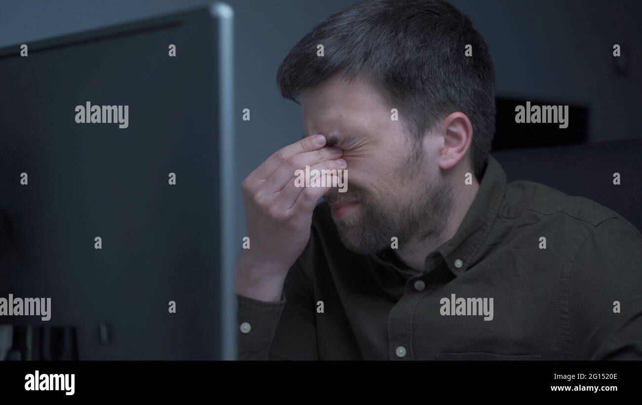 Tired software developer having eye hi-res stock photography and images ...