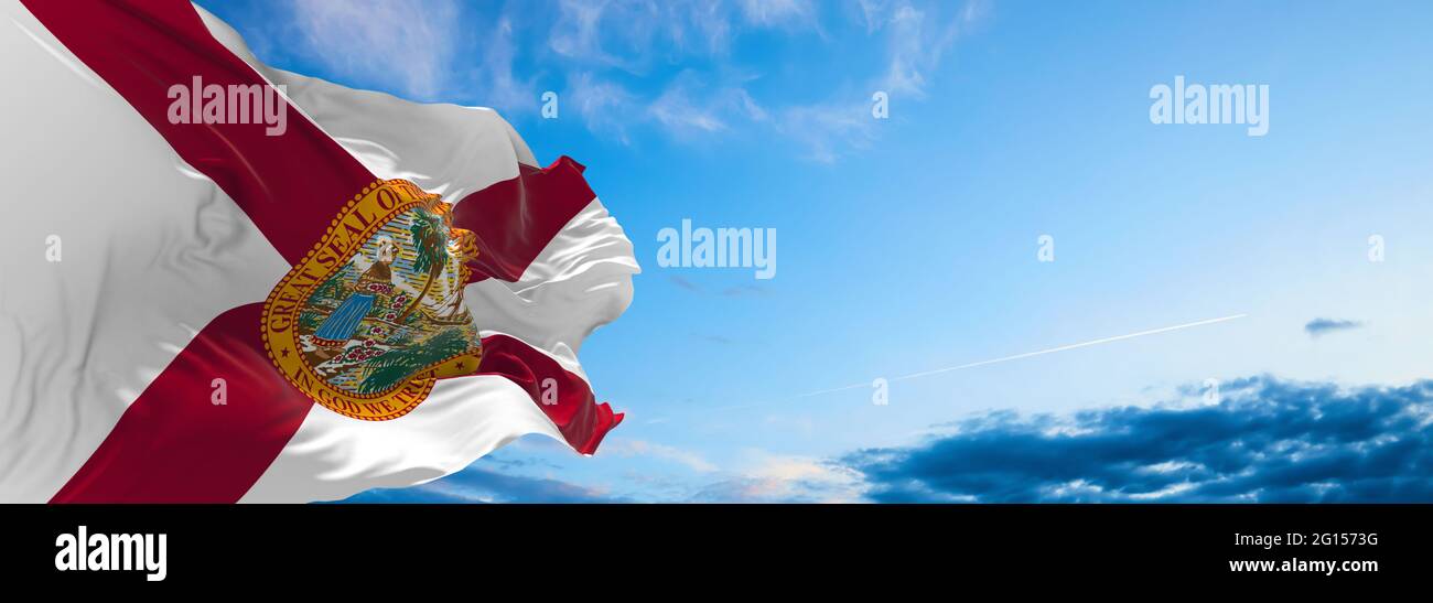 flag of Florida at cloudy sky background on sunset. Patriotic concept ...