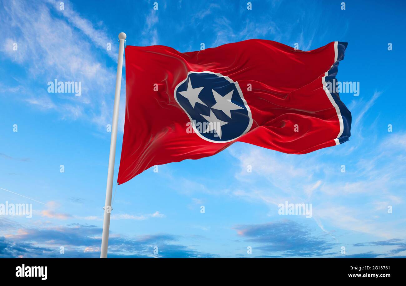 flag of Tennessee at cloudy sky background on sunset. Patriotic concept ...