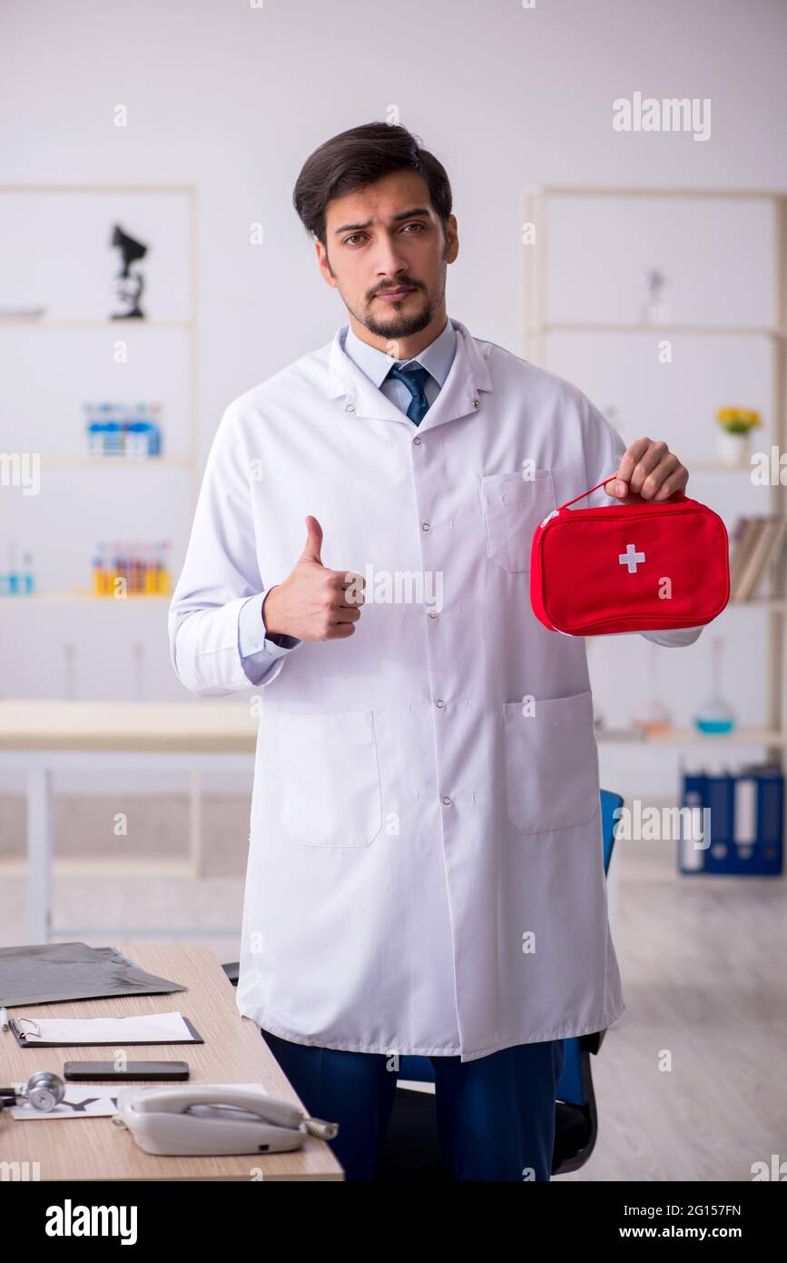 Young doctor paramedic in first aid concept Stock Photo - Alamy
