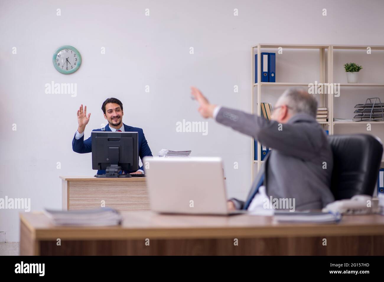 Two employees working in the office Stock Photo - Alamy