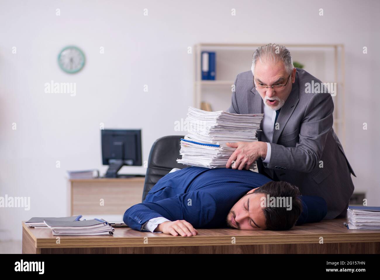 Two employees and too much work in the office Stock Photo - Alamy