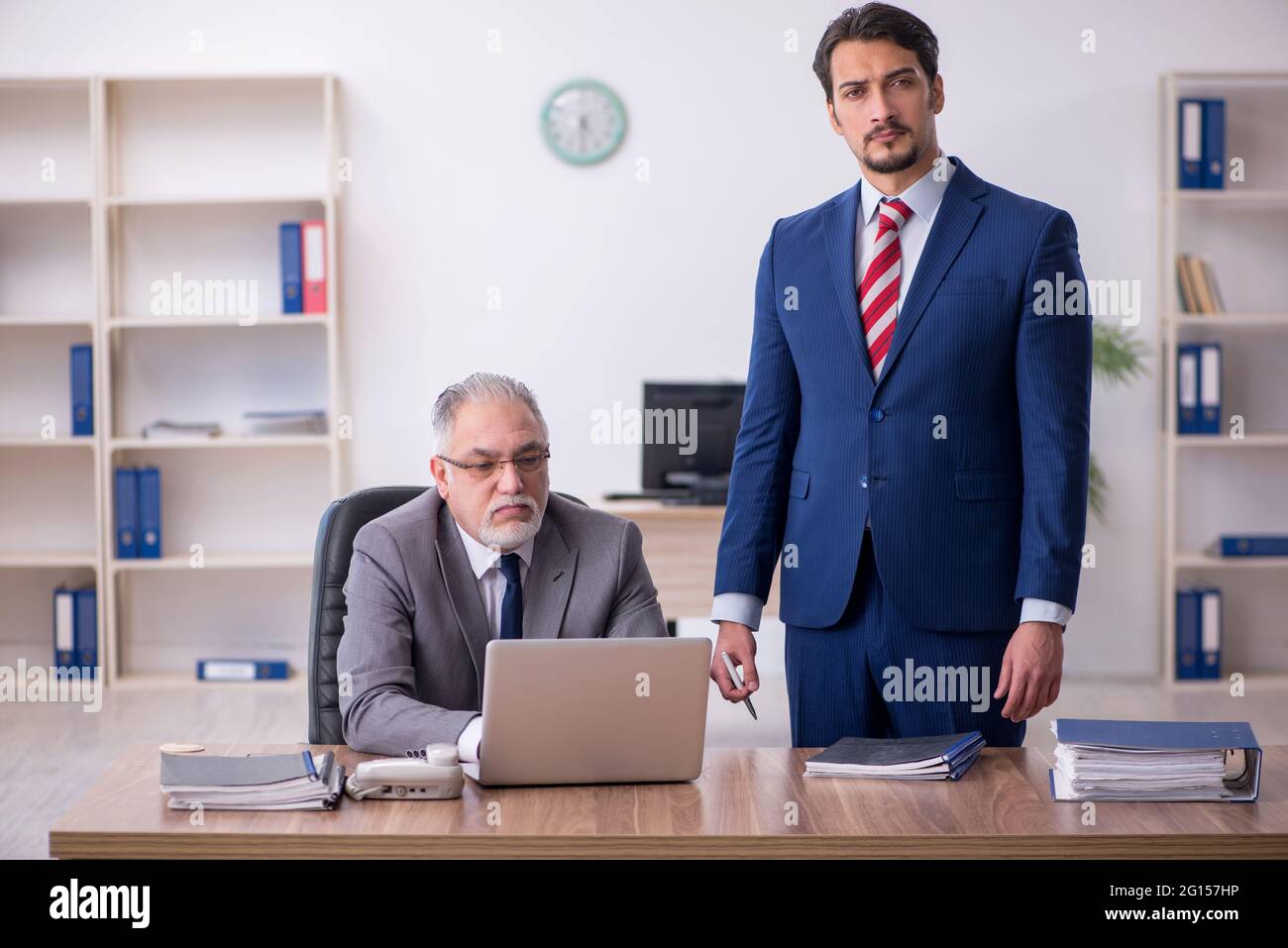 Two employees working in the office Stock Photo - Alamy