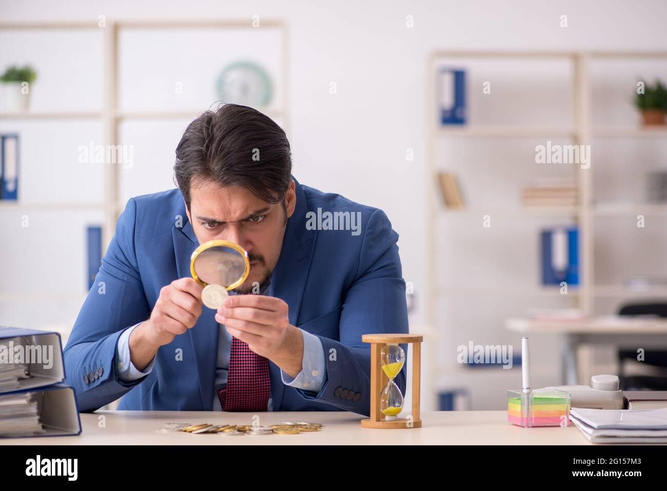 Man earning money via Internet in time management concept Stock Photo ...
