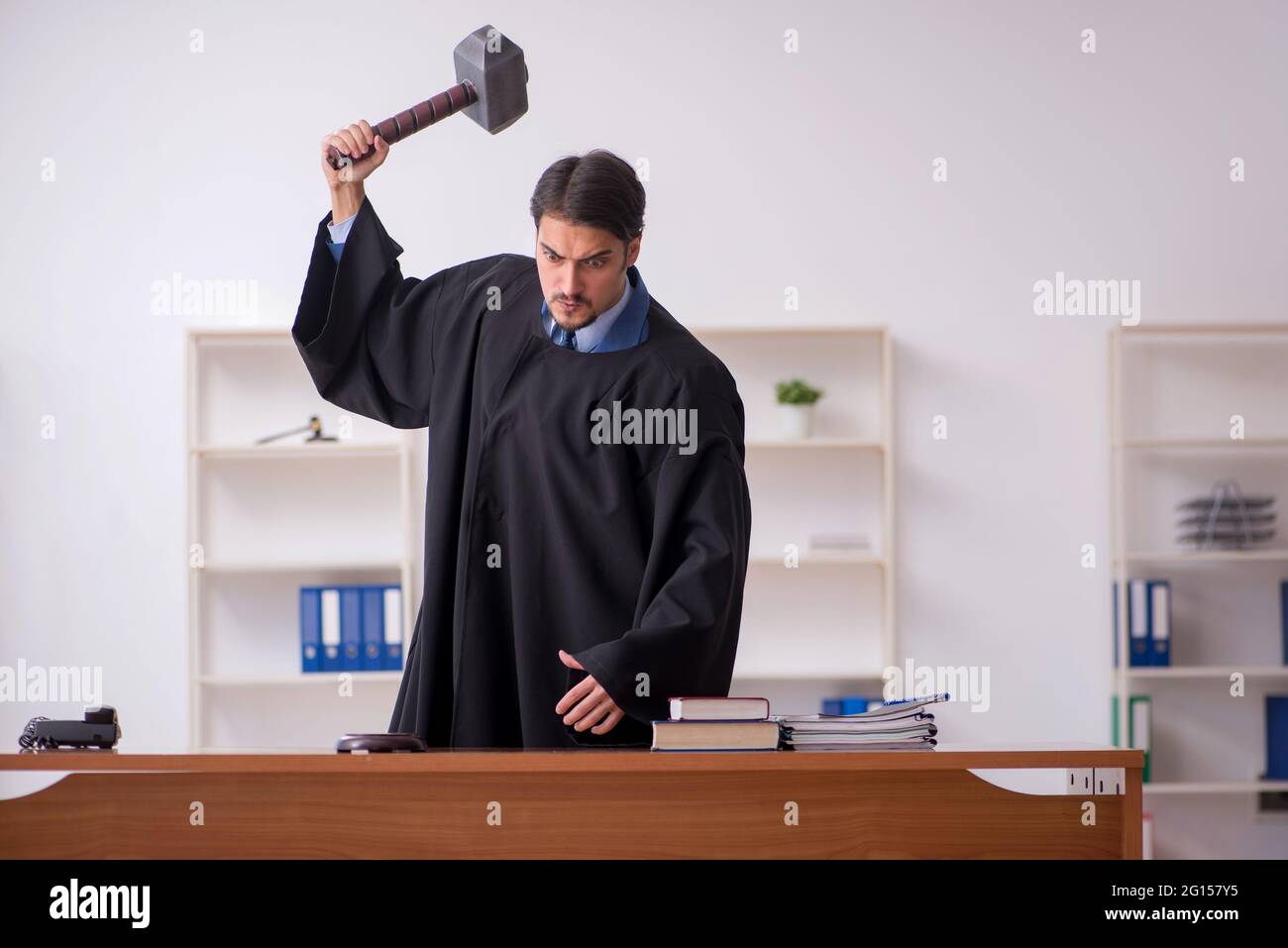 Young judge working in the courtroom Stock Photo - Alamy