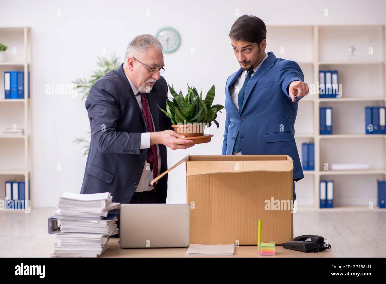 Two employees in dismissal concept Stock Photo - Alamy