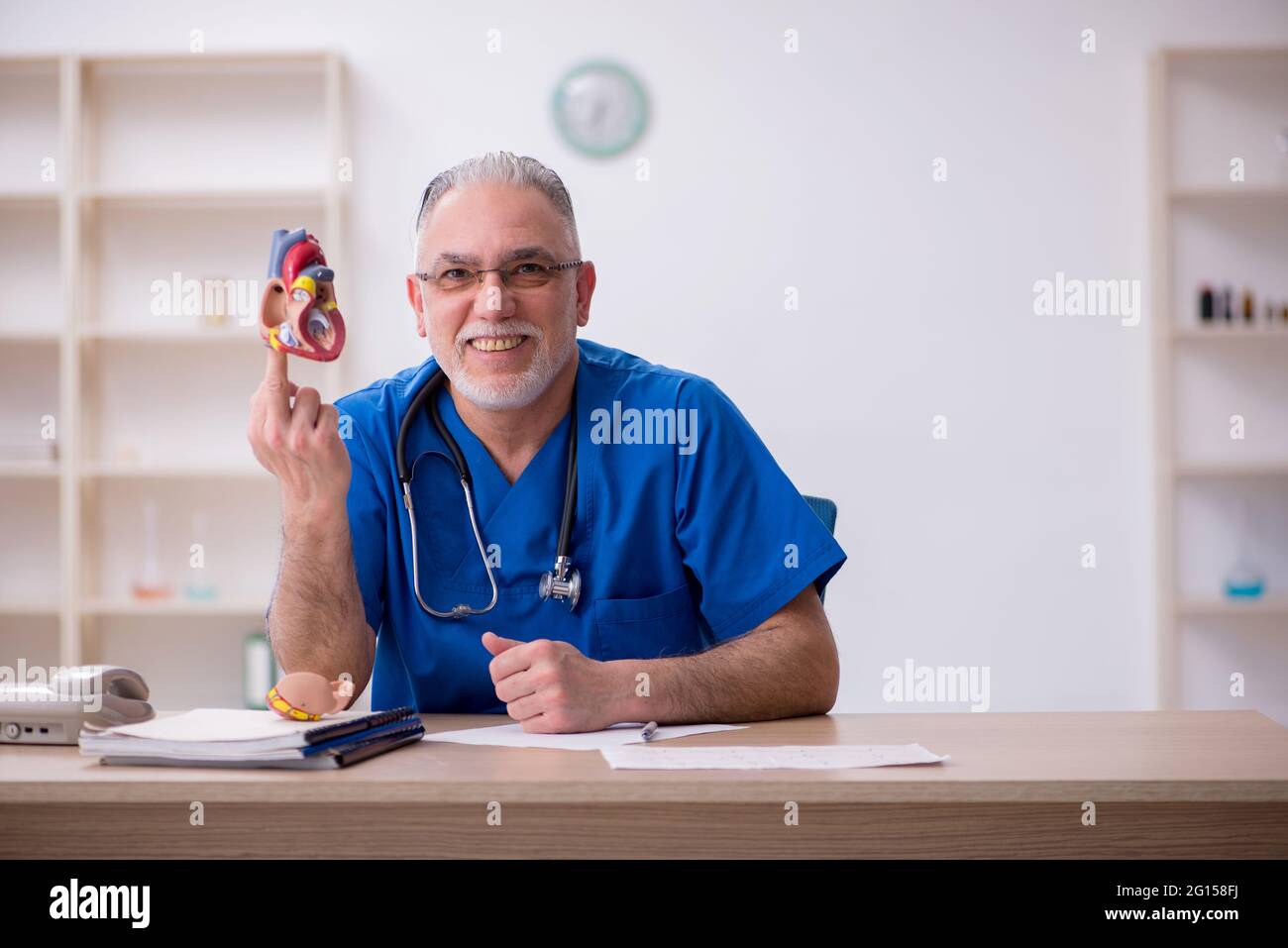 Experienced male doctor cardiologist working in the clinic Stock Photo ...