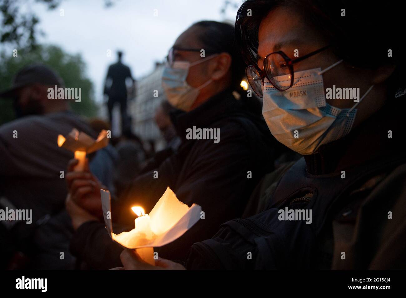 London, UK. 4th June 2021. Participants light up candles to remember ...