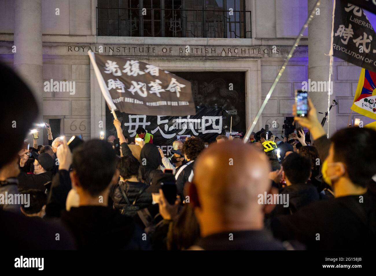 London, UK. 4th June 2021. The crowd gather opposite the Chinese ...