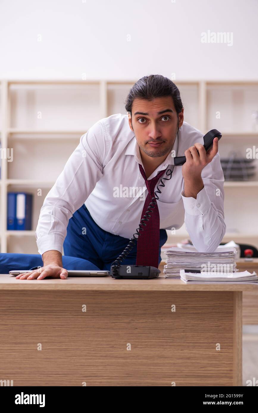 Extremely tired businessman male employee in the office Stock Photo - Alamy