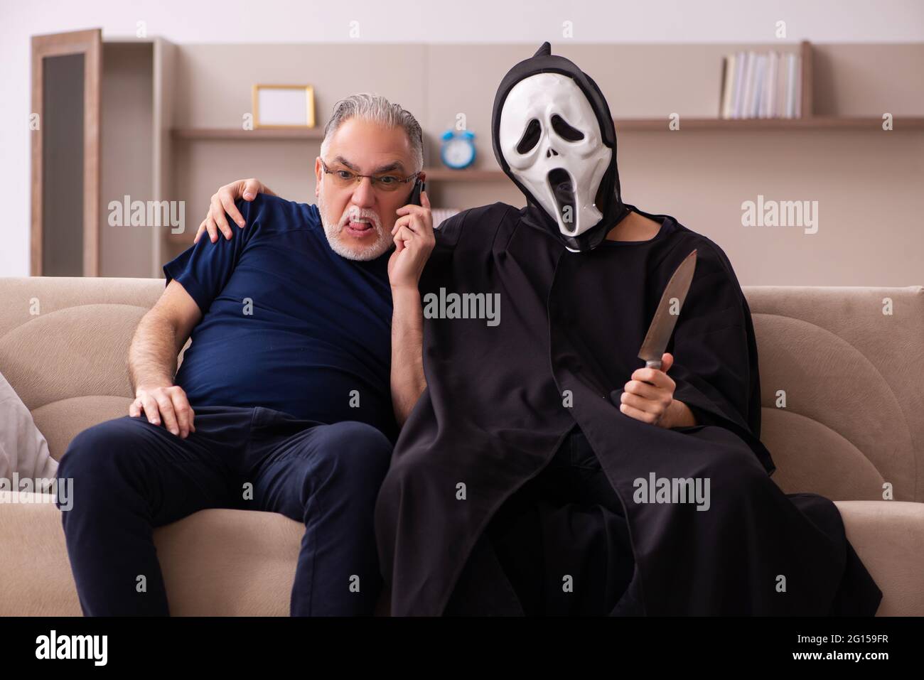 Devil coming to old dying man Stock Photo - Alamy