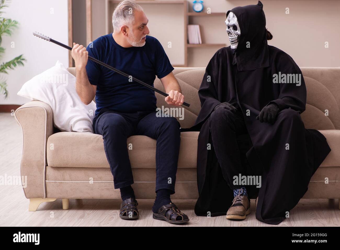 Devil coming to old dying man Stock Photo - Alamy