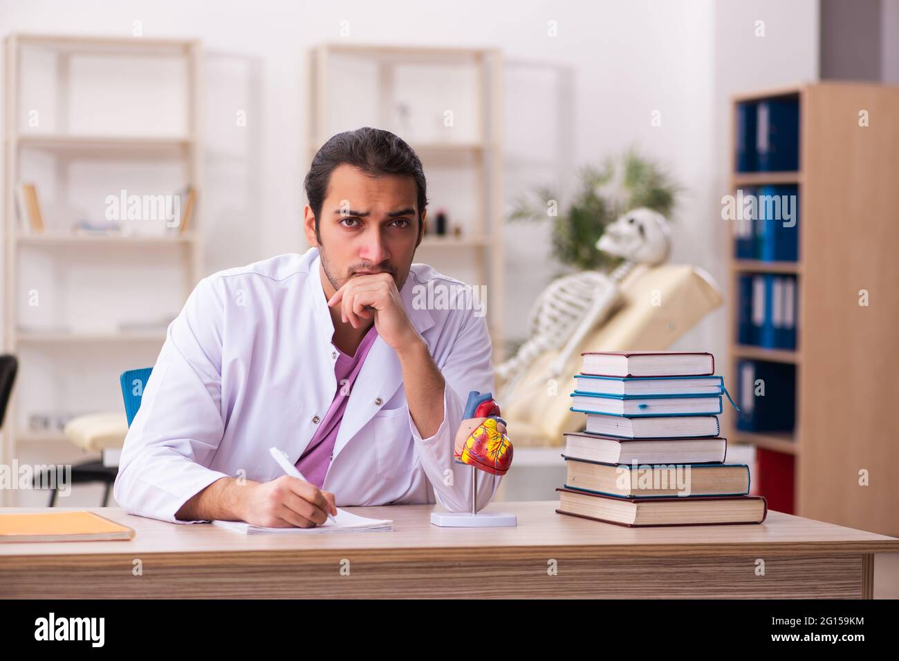 Young doctor student cardiologist sitting in the classroom Stock Photo ...