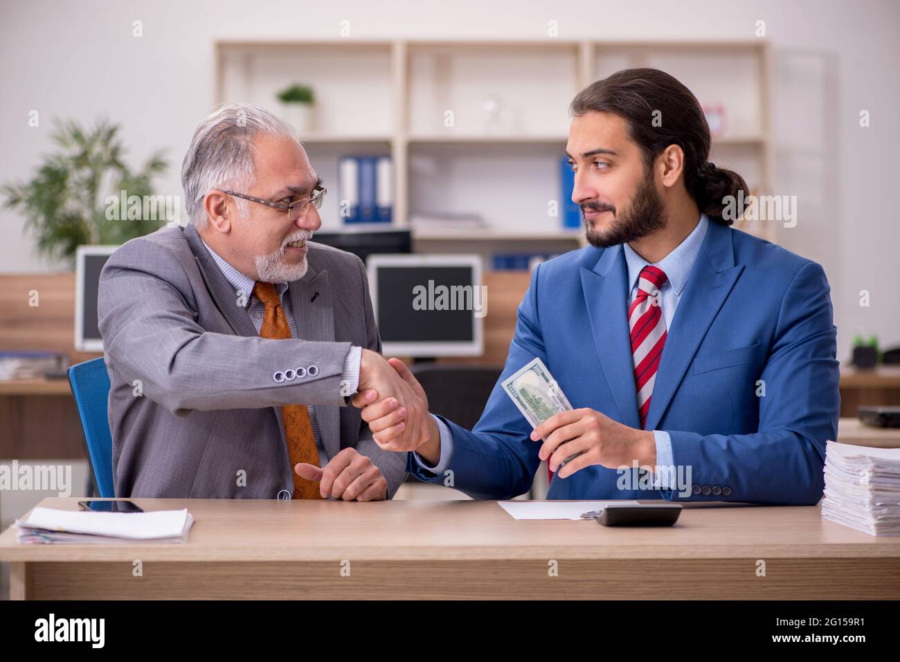 Giving salary to employees hi-res stock photography and images - Alamy