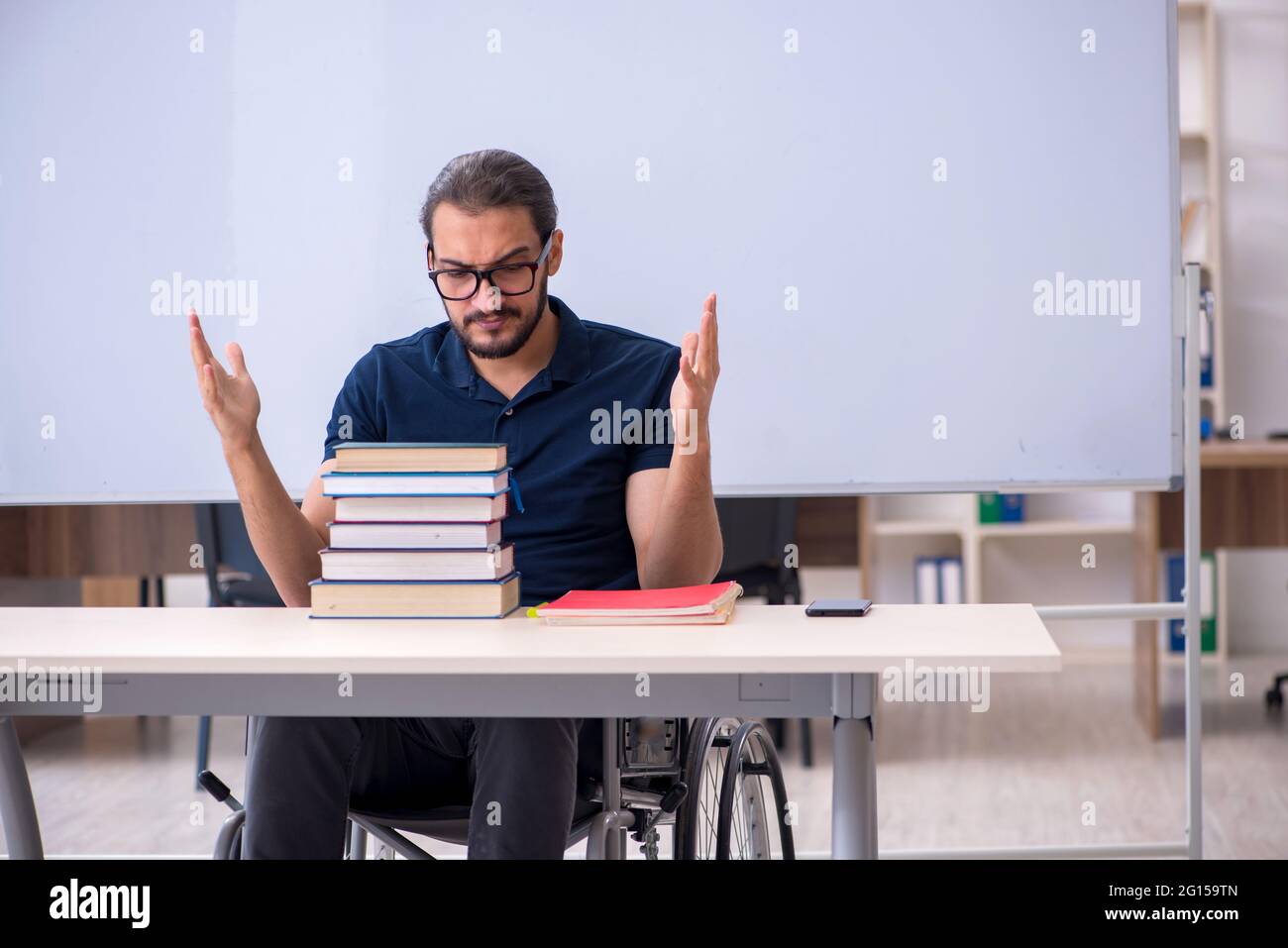 Young handicapped student in the classroom Stock Photo - Alamy
